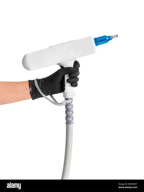 The Hand Of A Cosmetologist Holds A Laser Handpiece With A Nozzle For
