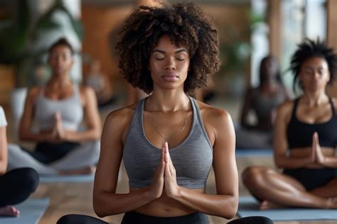 Woman In A Yoga Class Meditating With Eyes Closed Premium Ai