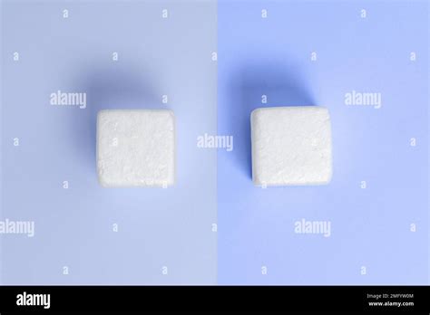 White Styrofoam Cubes Lying On Coloured Desk Brand New Information
