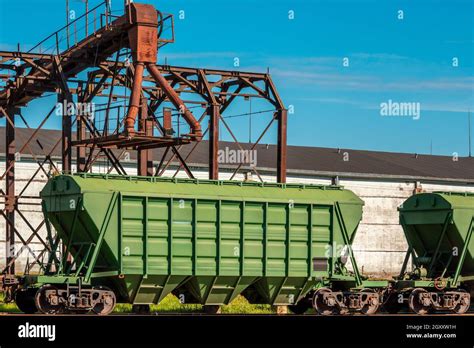 Green Loading Railway Wagon Standing Near The Elevator Grain Silo