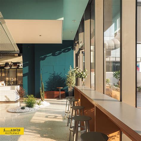 طراحی داخلی کافی شاپ مدرن، ترکیب چوب، فلز و رنگ خط معمار