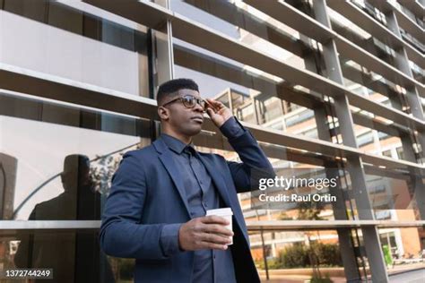 Guy Adjusting Black Suit Photos And Premium High Res Pictures Getty