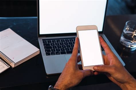 Anonymous Man Browsing Smartphone Near Laptop Free Photo 4azom6