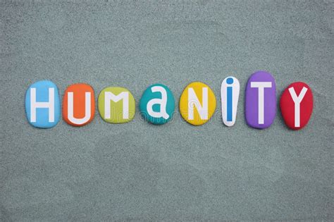 Humanity Social Slogan Composed With Multi Colored Stone Letters Over