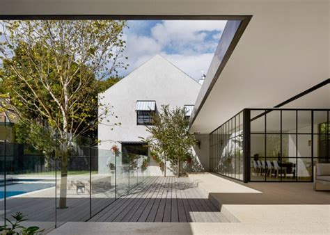 Be Architecture Adds Gridded Glass Rooms To Australian House