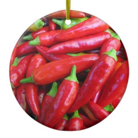 A Red Pepper Ornament Hanging On A Yellow Background With The Image Of