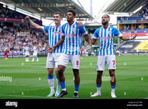 Tino Anjorin 8 Of Huddersfield Town Celebrates With Sorba Thomas And
