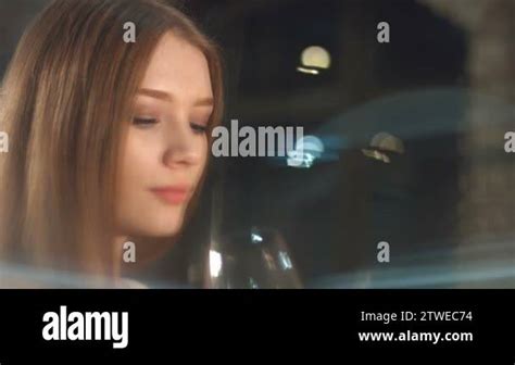 A Pretty Girl Tasting Red Wine In A Wine Cellar Slow Motion Close Up