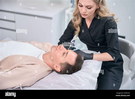 Man Visiting Cosmetologist Office For Botulinum Toxin Injections Stock
