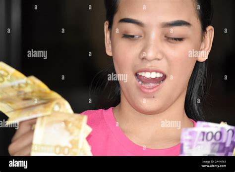 An Attractive Diverse Female Counting Money Stock Photo Alamy
