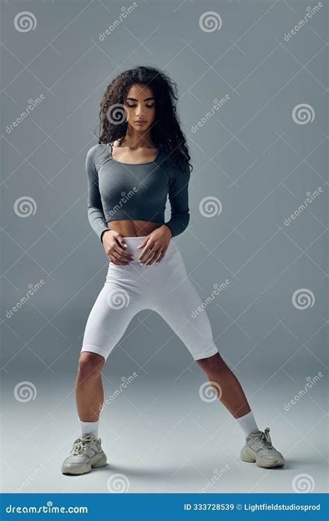A Young Woman Stretches Her Legs Stock Image Image Of Energy Focused