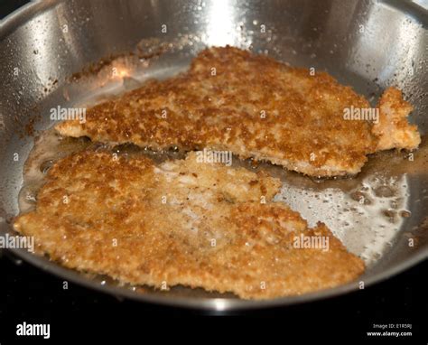 Breaded Pork Cutlets Schnitzel In Frying Pan Stock Photo Alamy