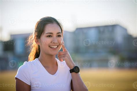 Asian Woman Applying And Spraying Sunscreen Cream On Skin Before Run Sports And Healthy Concept
