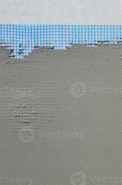 The Texture Of The Wall Covered With Gray Foam Polystyrene Plates Covered With A Blue