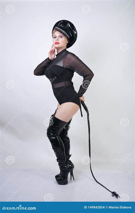 Beautiful Curvy Strict Mistress With Red Lips In Black Bodysuit And