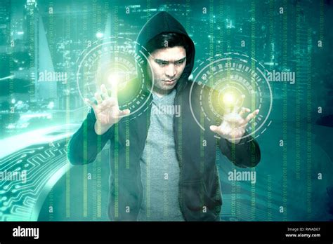 Young Asian Hacker In Black Hoodie Touching Virtual Screen With Binary