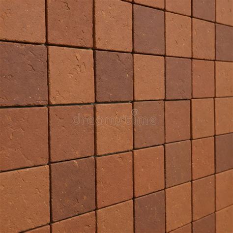 Array Of Textured Square Terracotta Tiles Angled Slightly Stock