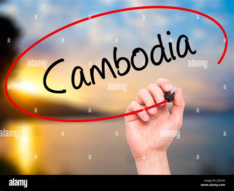 Man Hand Writing Cambodia With Black Marker On Visual Screen Isolated On Nature Business