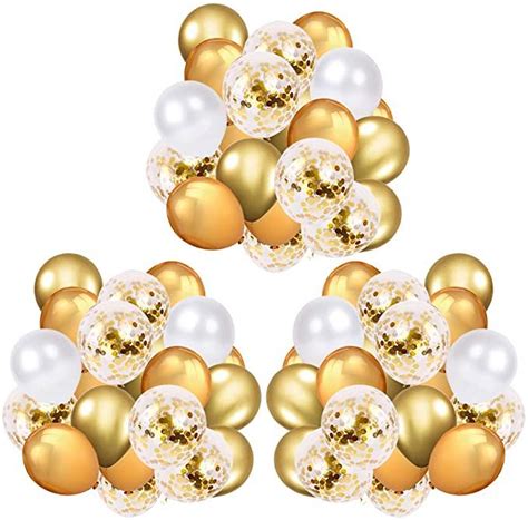 Gold And White Balloons Are Arranged Together