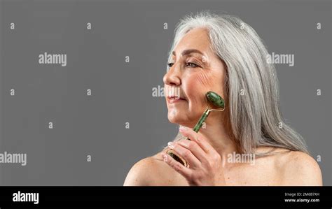 Serious Old European Lady With Gray Hair Do Jade Massage Enjoy