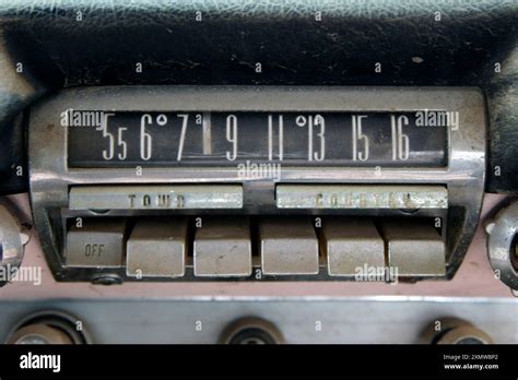 A Vintage Old Am Push Button Car Radio Dial In Chrome Mounted In A
