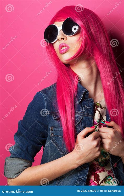Young Fashionable Woman With Pink Hair And Big Sunglasses Over Pink