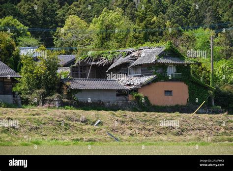 japan kyushu example of an old house no longer being maintained stock