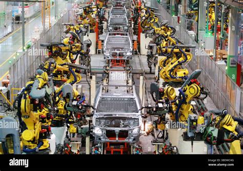 Busy Smart Assembly Line Of An Auto Manufacturing Enterprise In