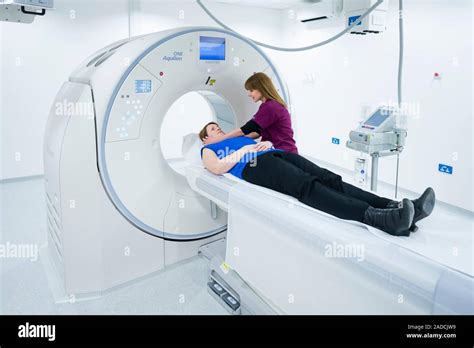 Radiographer Preparing A Ct Scan Radiographer Talking With A Patient