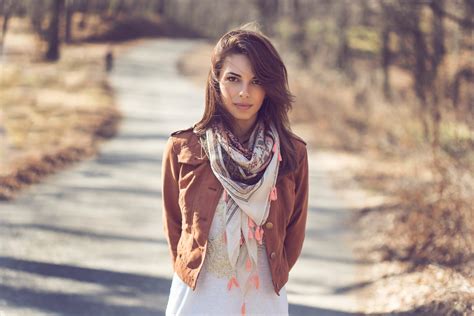 A Model Wearing A Scarf In A Chic Simple Onpost Style With A Coquette Touch
