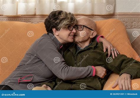 Father And Daughter Bonding While Sitting On A Couch Stock Image