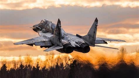 Download Caption Majestic Mikoyan Mig 35 Fighter Jets Soaring Over A