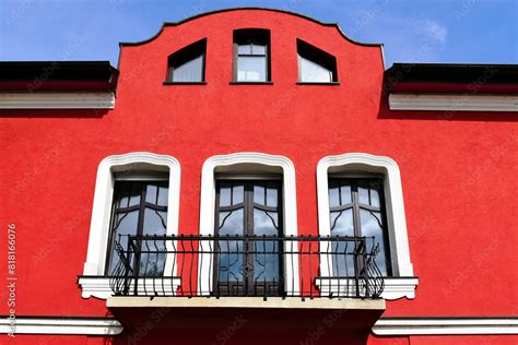 Red Stucco Building Elevation Detail With Wrought Iron Balustrade And
