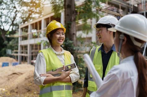 Structural Engineer And Architect Discussing And Working With