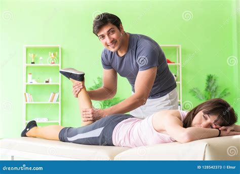 The Young Doctor Chiropractor Massaging Patient Stock Image Image Of
