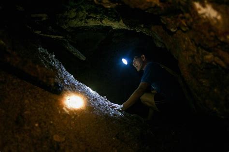 Premium Photo Side View Of Man Working At Mine Tunnel