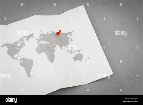 Paper Folded World Map With Red Pin Pointer Stock Photo Alamy