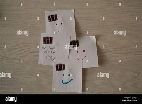 White Sticky Notes With Smiley Faces And A Motivational Quote On A
