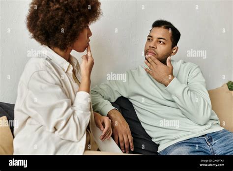 An African American Couple Uses Sign Language To Communicate While
