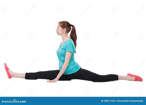 Side Splits Dance Pose By Woman Against Yellow Stock Image