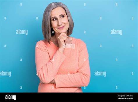 Photo Of Deep Thinking Girl Grey Hair Wear Peachy Shirt Touch Chin