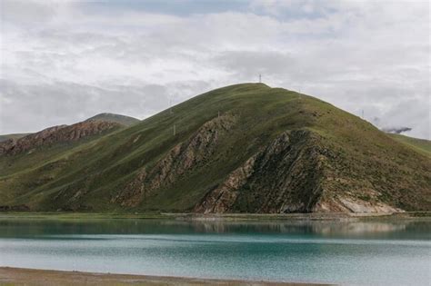 Premium Photo The Beautiful Quiet Blue Lake Under The Dark Clouds