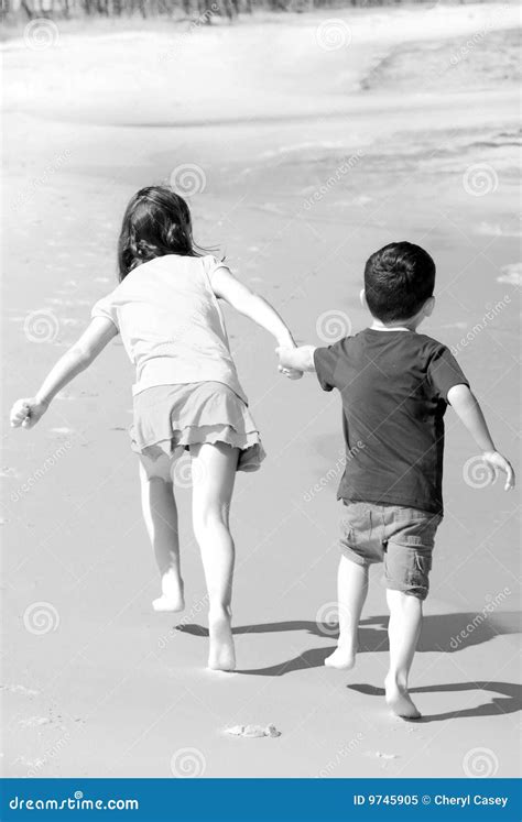 Sister Pulling Brother On Beach Stock Image Image Of Hands Ocean