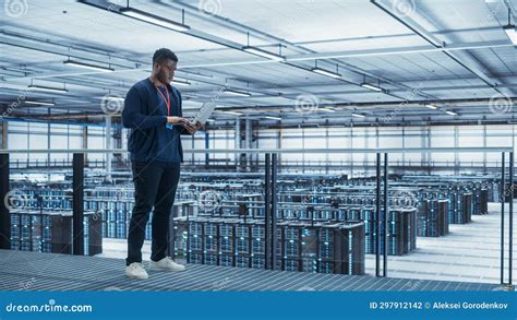 Data Center Engineer Using Laptop Computer Server Farm Cloud Computing Specialist Facility With