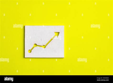 White Statistics Arrow Pointing Up On Yellow Color Background Growth