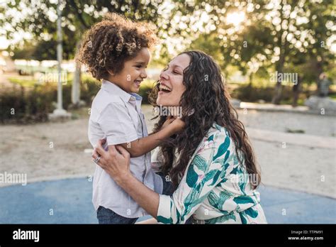 Cheerful Mother And Son Playing At Park Stock Photo Alamy
