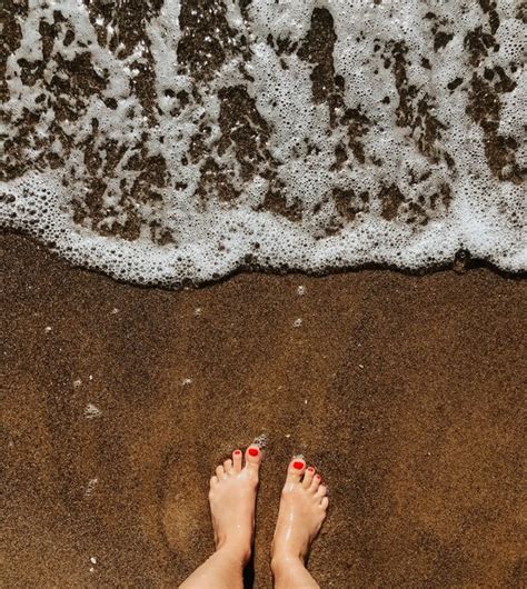 Premium Photo Woman Legs Barefoot At Sea Foam Waves On Sand Beach