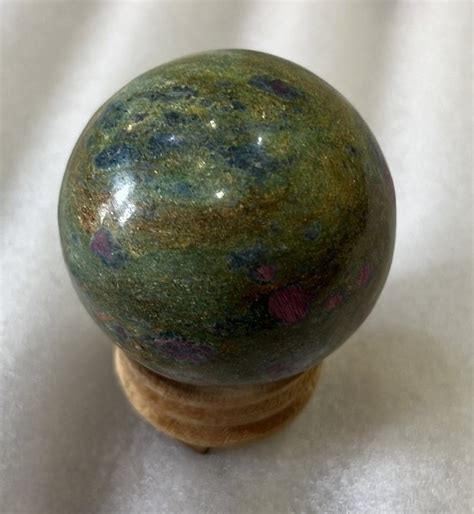 Olive Green Ruby Zoisite Crystal Sphere Size 120mm 15gm At 1500 Kg In Khambhat