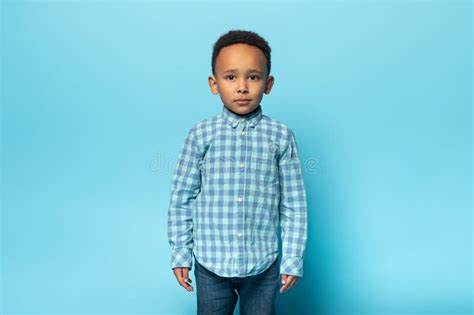 Portrait Of Adorable Black Boy In Casual Outfit Posing Over Blue