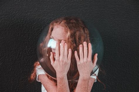 Premium Photo Young Woman Wearing Glass Container Against Black
